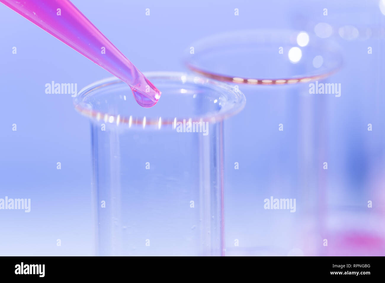Test tube in rack and pipette media dispenser Stock Photo - Alamy