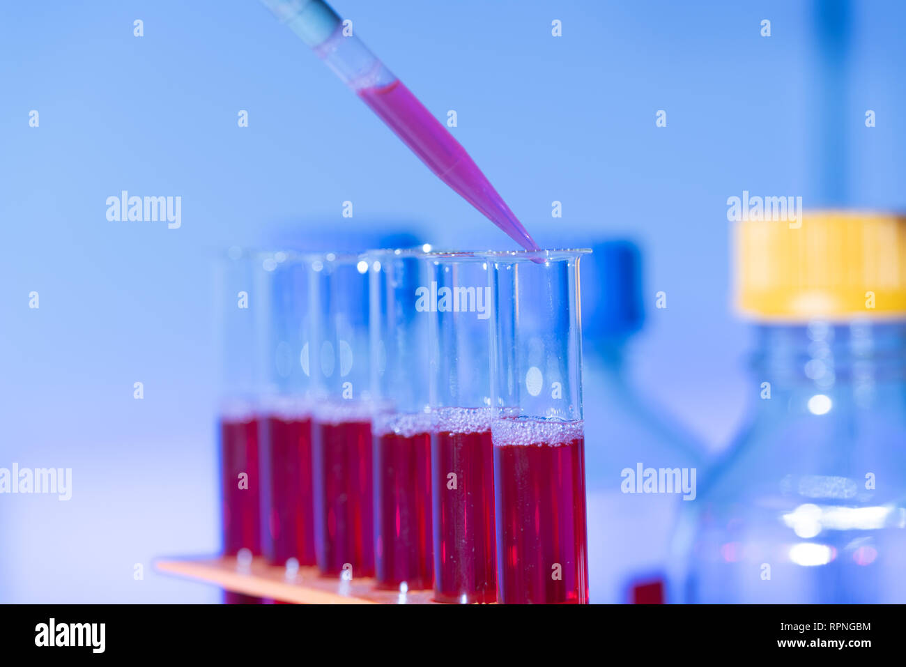 Test tube in rack and pipette media dispenser Stock Photo - Alamy