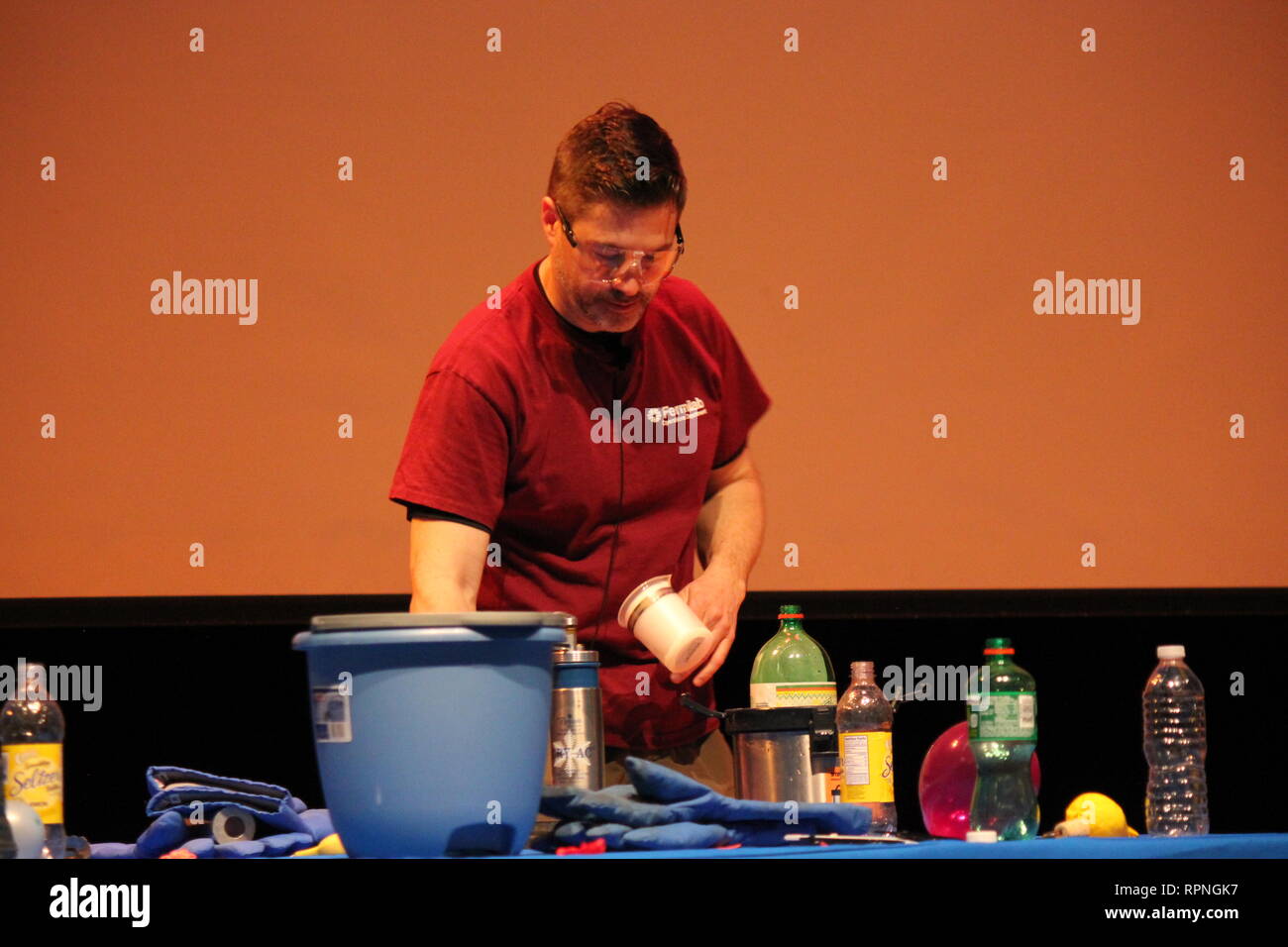 Scientist performing science experiments on stage Stock Photo - Alamy