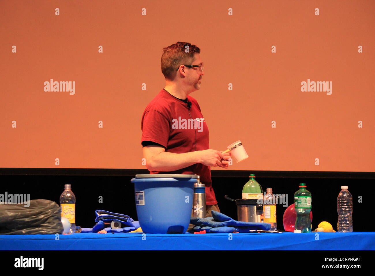 Scientist performing science experiments on stage Stock Photo - Alamy