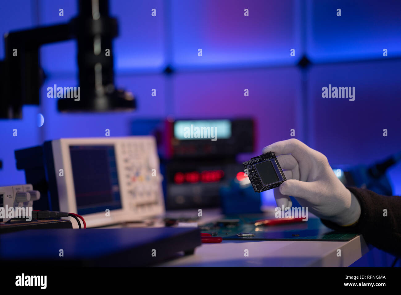 Check electronics device in industrial lab Stock Photo - Alamy
