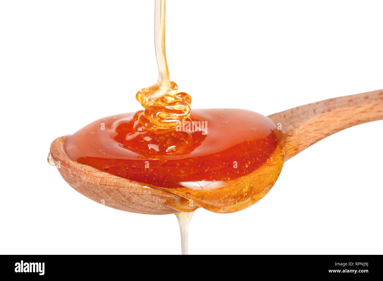 Dripping honey spoon Cut Out Stock Images & Pictures - Alamy