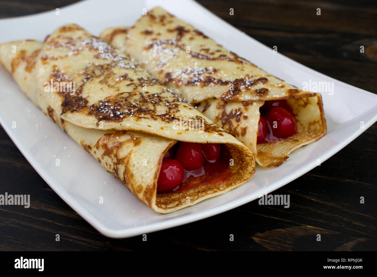 Cherry Filled Crepes Stock Photo - Alamy