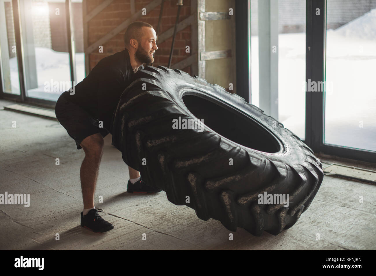 CrossFit Tire Technique. Powerful bodybuilder demonstrates rules and ...