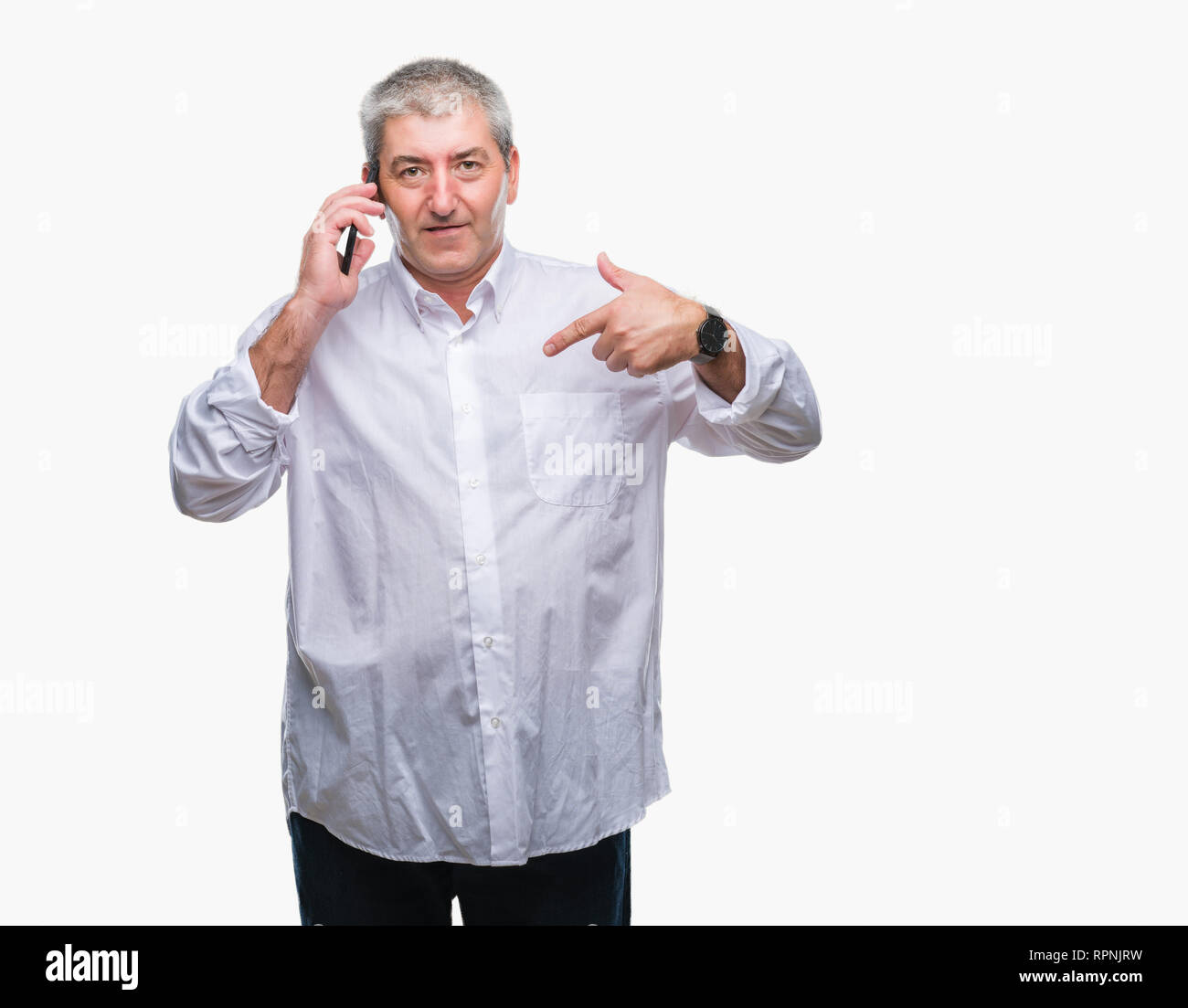 Handsome senior man talking on smartphone over isolated background with ...