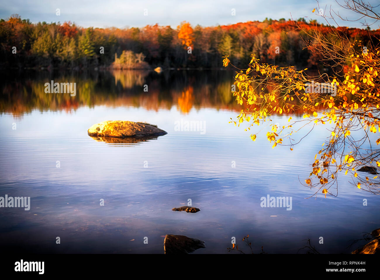 Reflections of the colorful autumn on the water at Burr Pond Torrington ...