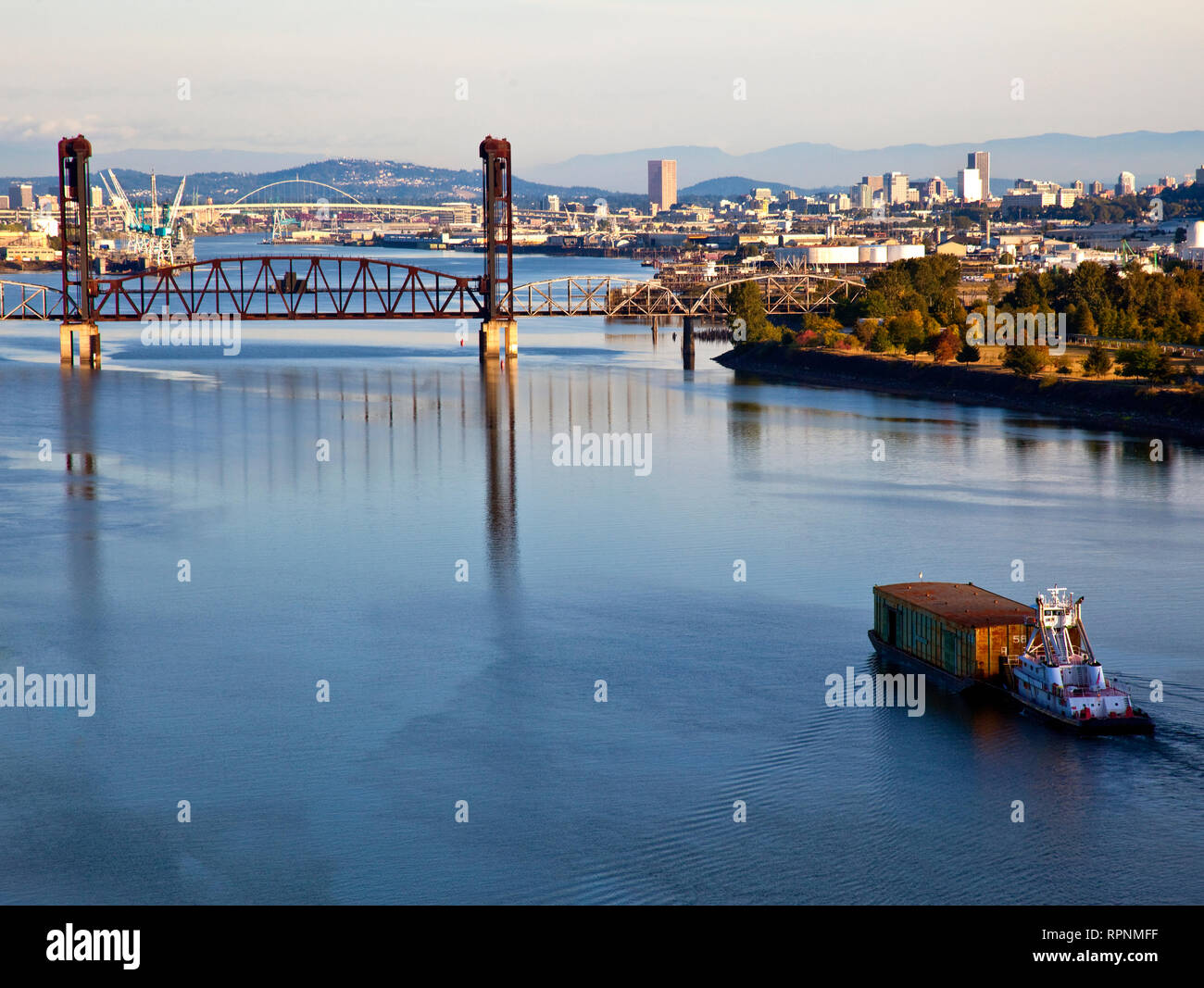 Tugboat Pushing Barge in River Stock Photo - Alamy