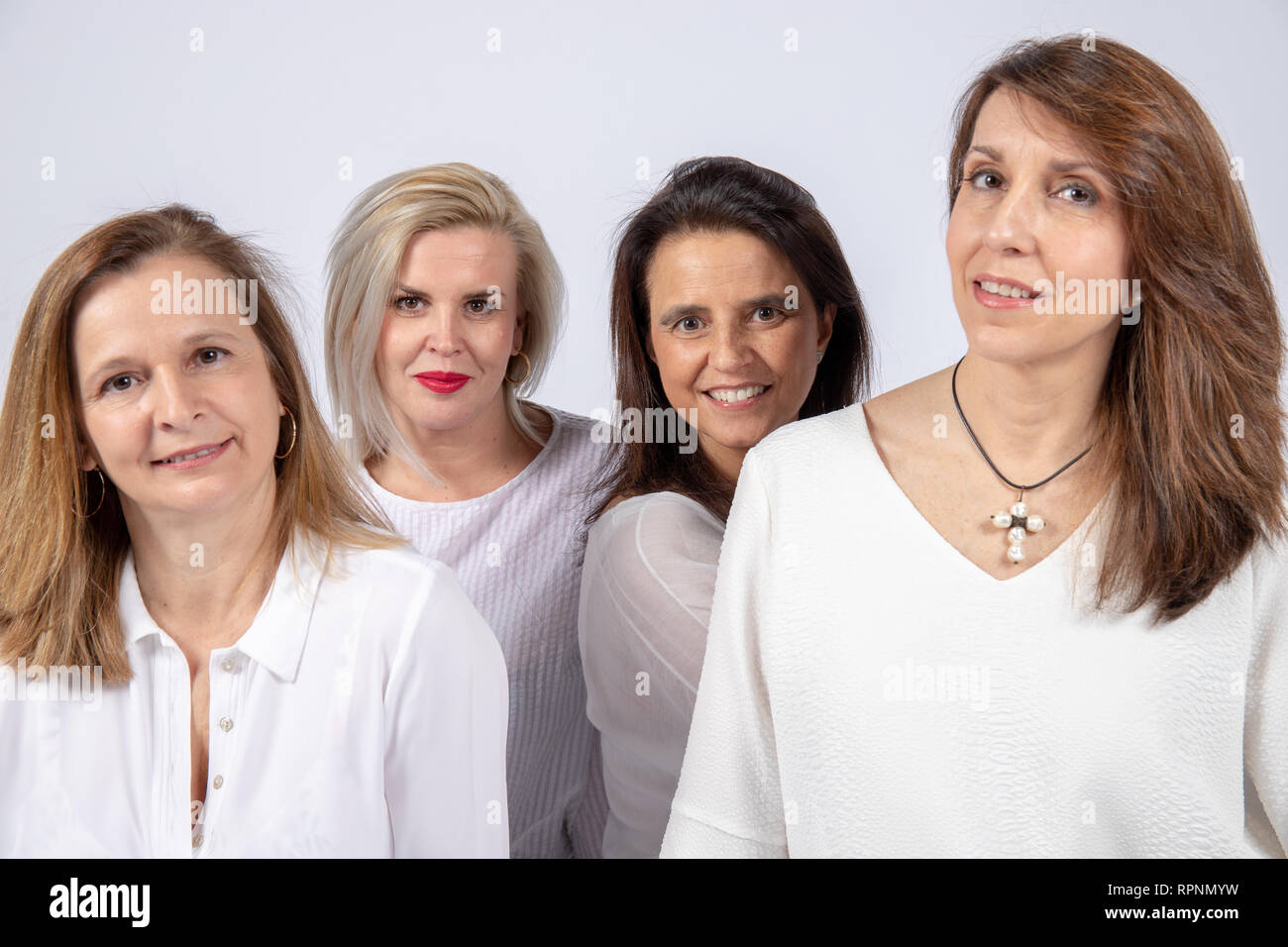 Group of 4 women, friends, middle-aged having fun in a photo session in ...