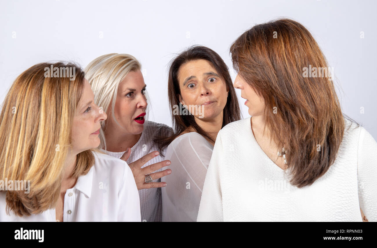 Group of 4 women, friends, middle-aged having fun in a photo session in ...