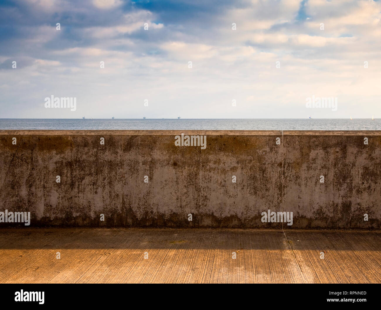 Wall Overlooking the Beach Stock Photo - Alamy