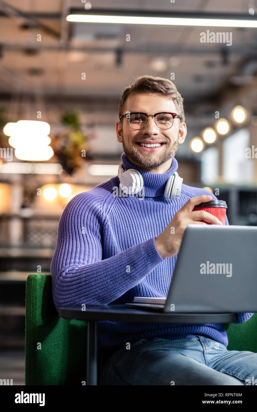 Pleased young man looking straight at camera Stock Photo - Alamy