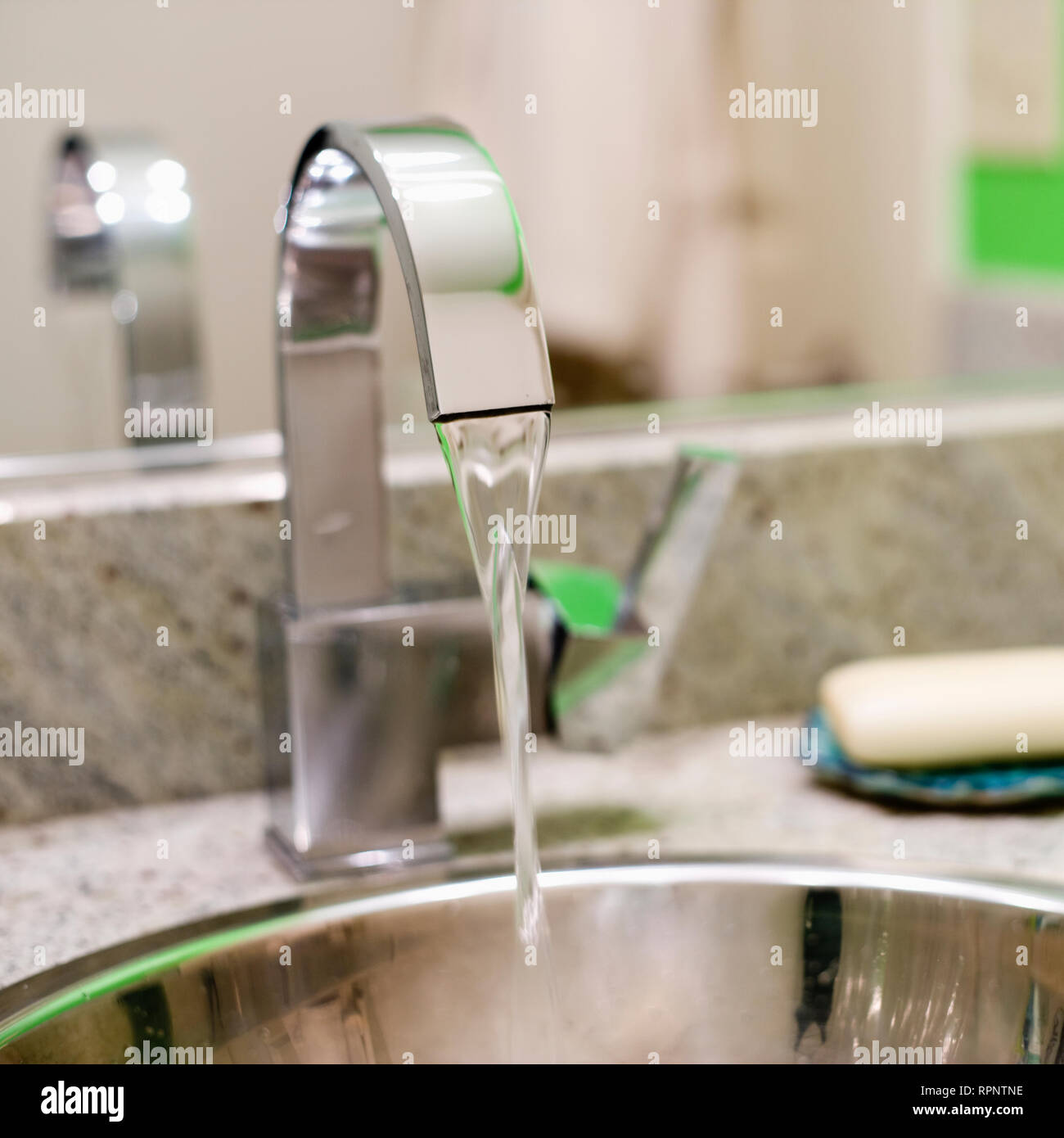 Running Faucet in the Bathroom Stock Photo - Alamy