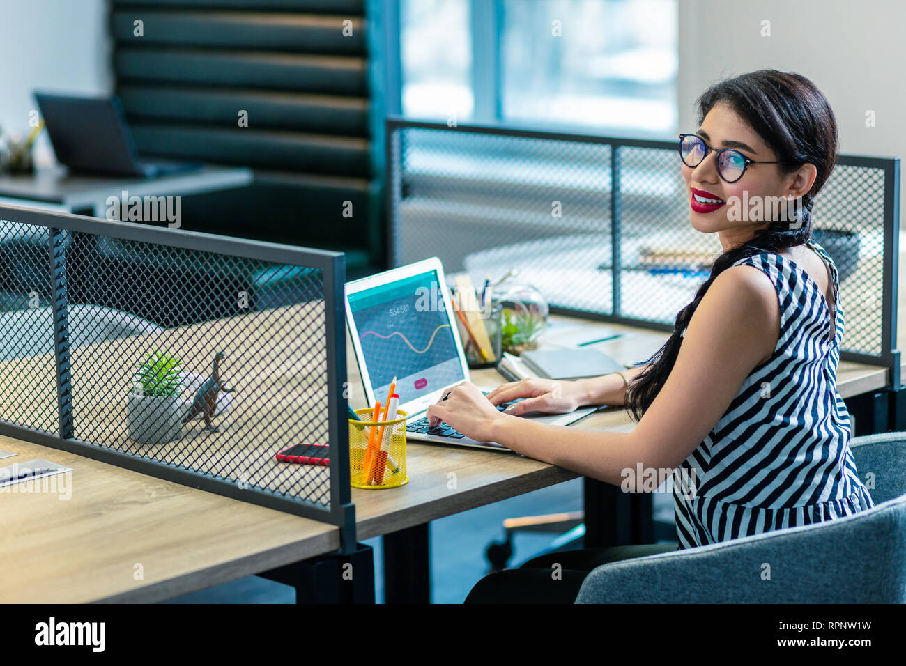 Happy office worker demonstrating her real emotions Stock Photo - Alamy