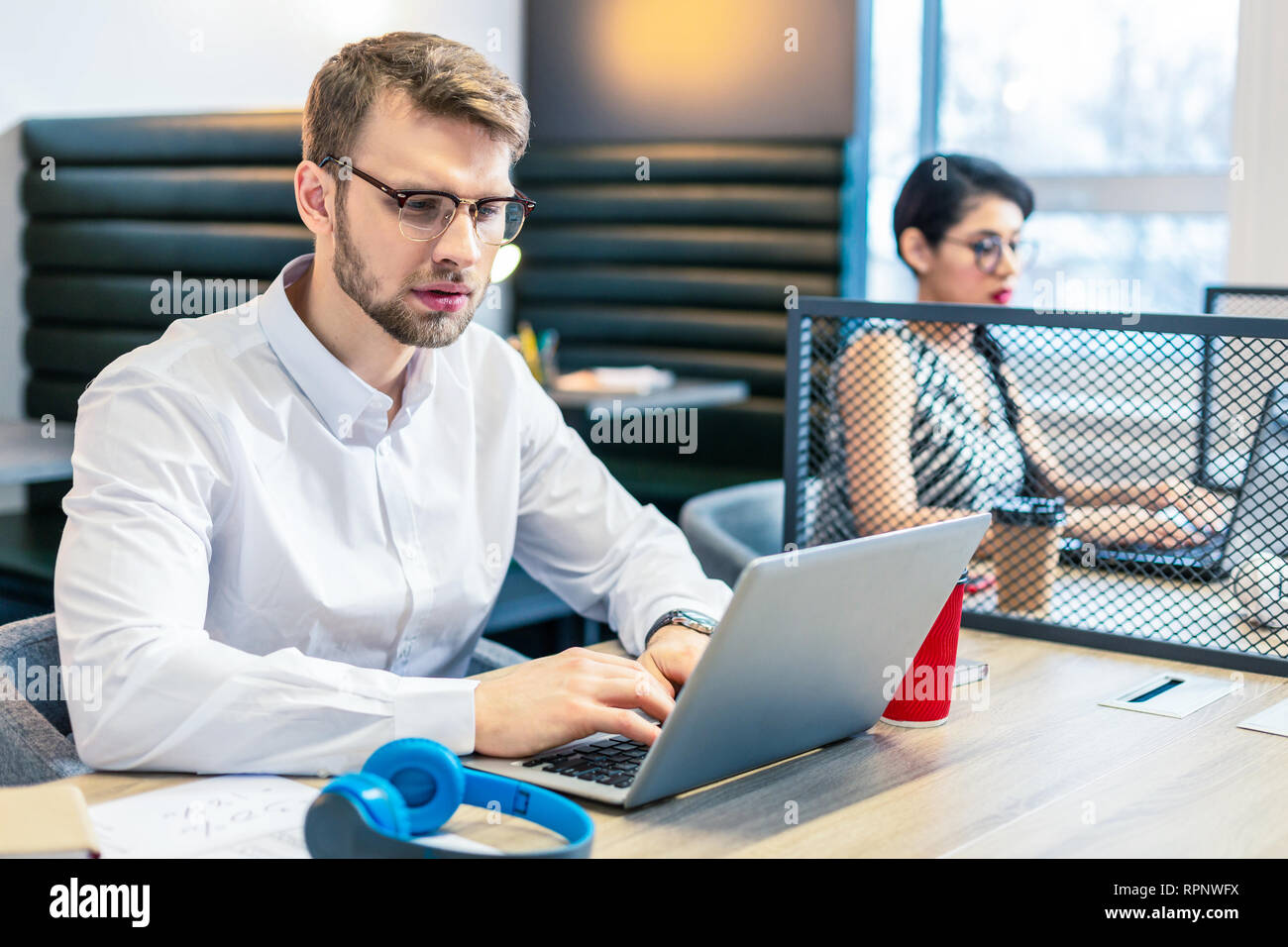Serious bearded man staring at screen of computer Stock Photo - Alamy