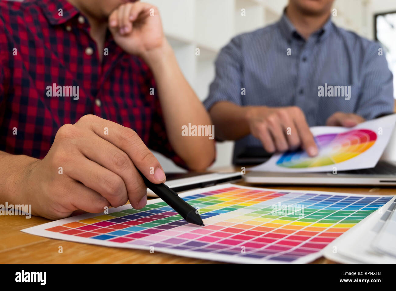 Graphic designers choose colors from the color bands samples for design ...
