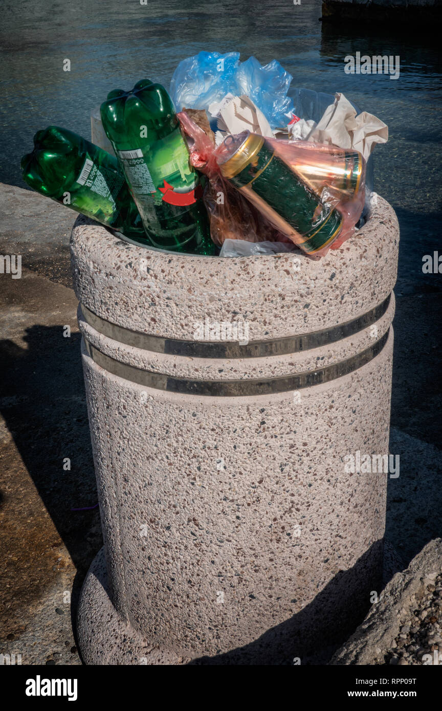 Garbage bin totally filled up Stock Photo - Alamy