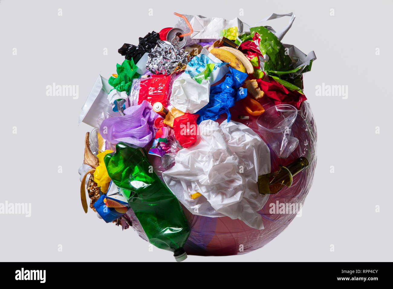 A globe of the earth with trash over white background, the concept of ...