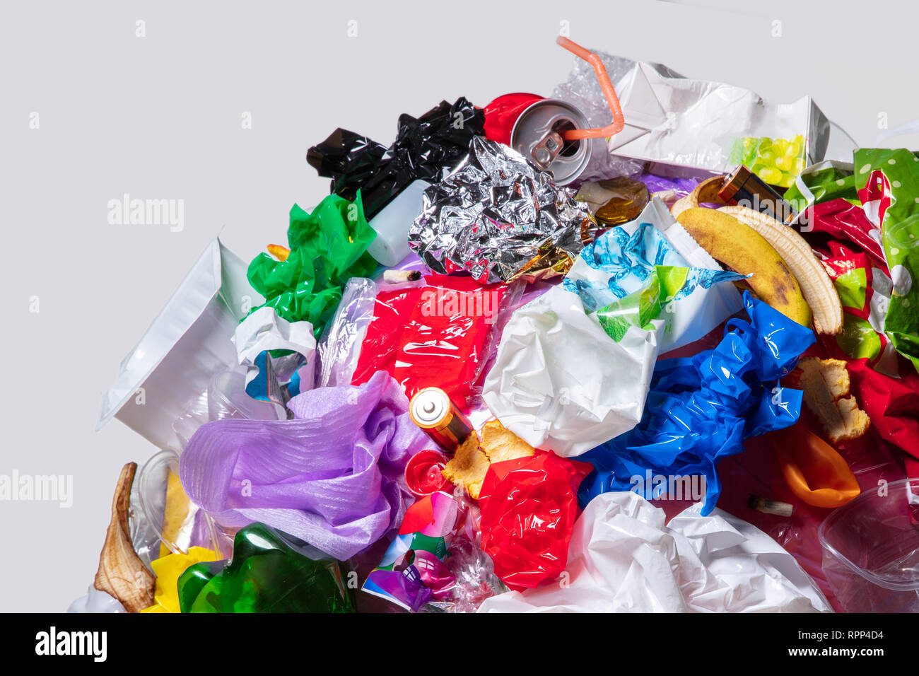 A globe of the earth with trash over white background, the concept of ...