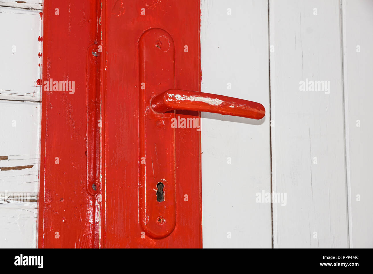 Red color wooden door with brass bolt Stock Photo - Alamy