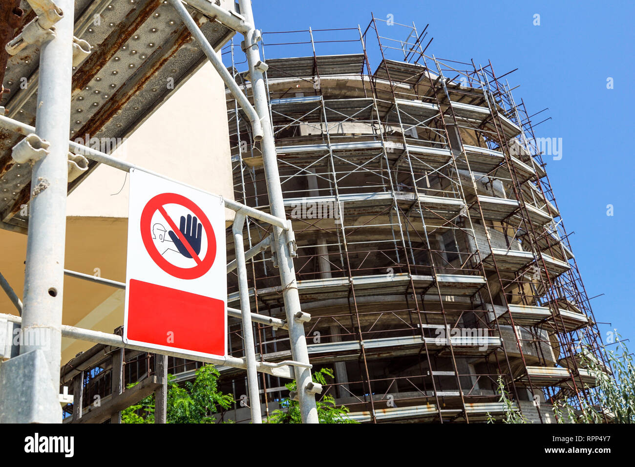 No entry sign on the fence in contruction site with house under ...