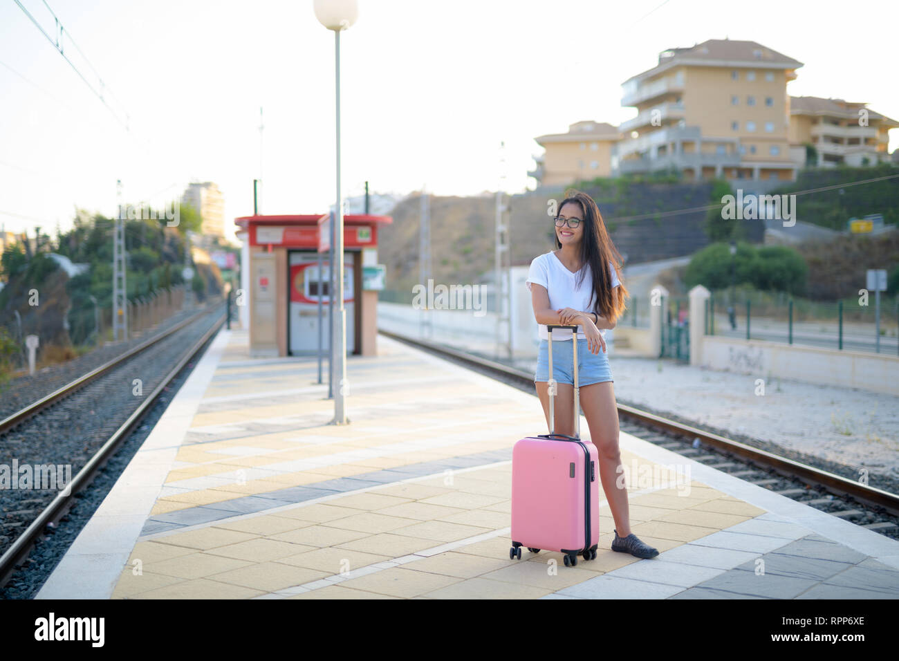 Young Happy Asian Tourist Woman Standing While Waiting For The Train ...