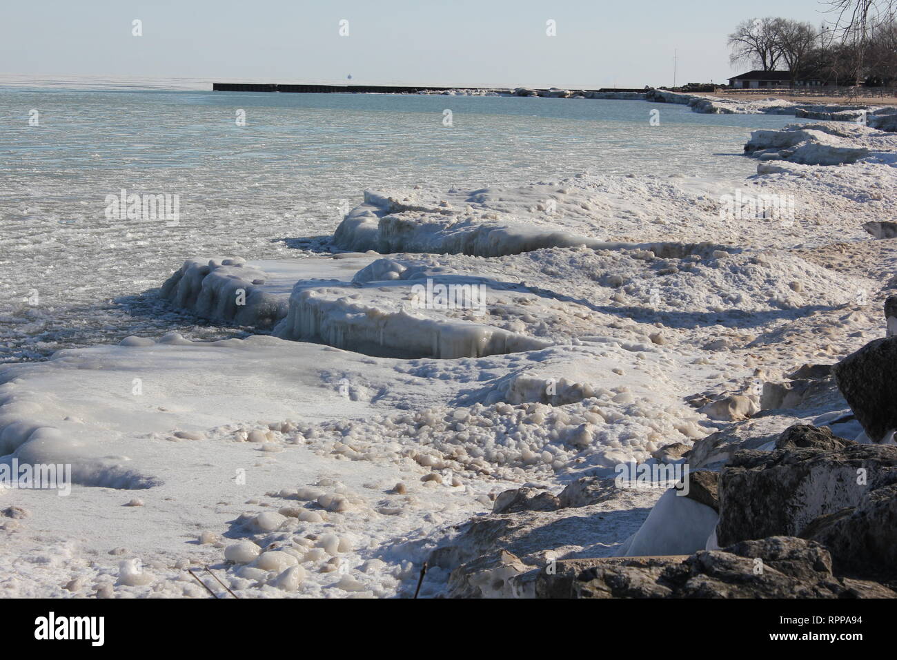 The frozen shoreline of Lake Michigan on a sunny winter day Stock Photo ...