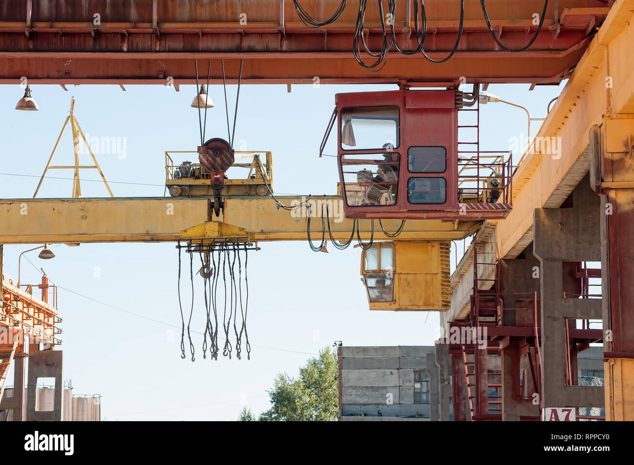 Operator of crane works at finished good warehouse Stock Photo - Alamy