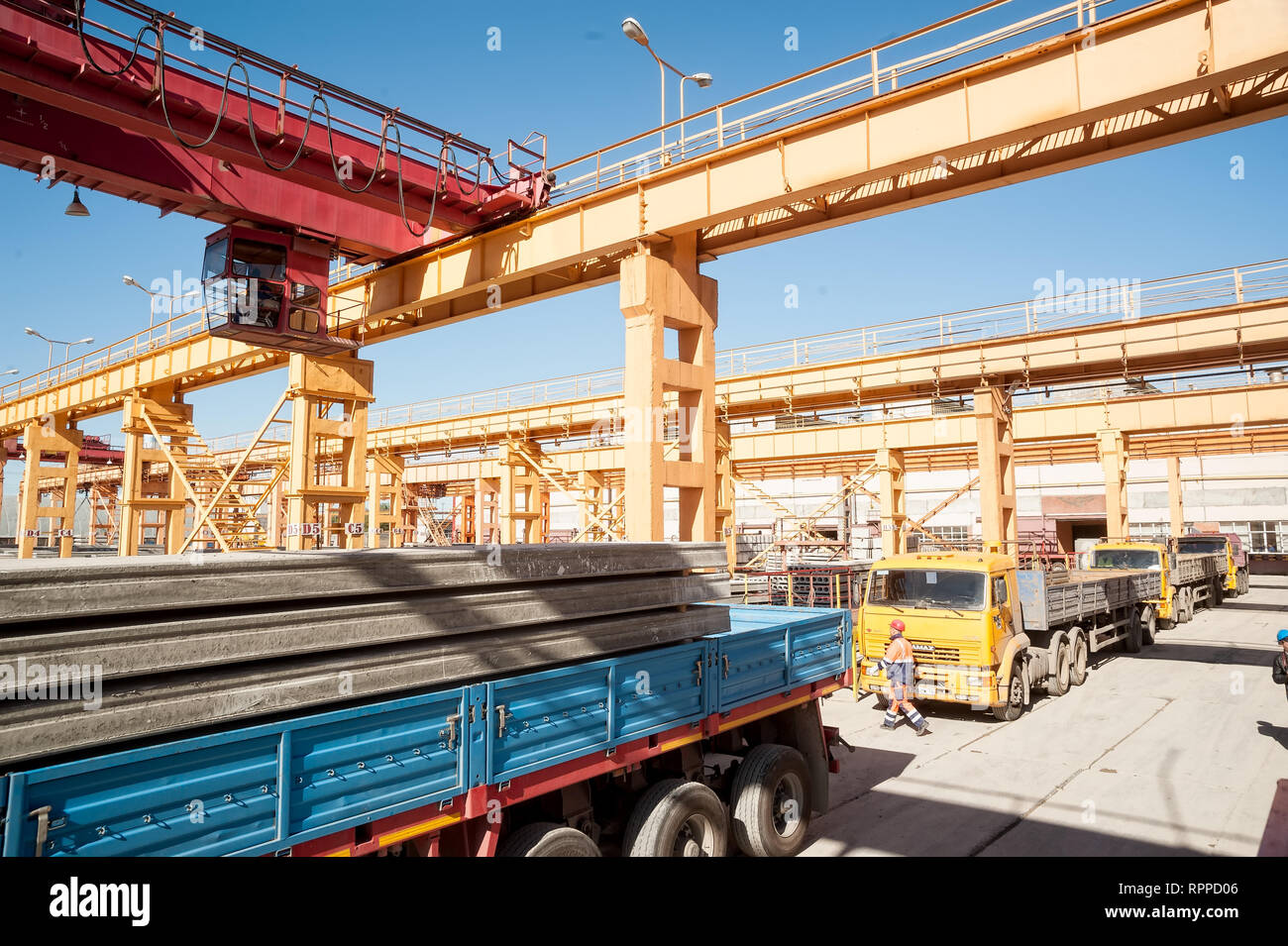 Loading concrete products in truck Stock Photo - Alamy