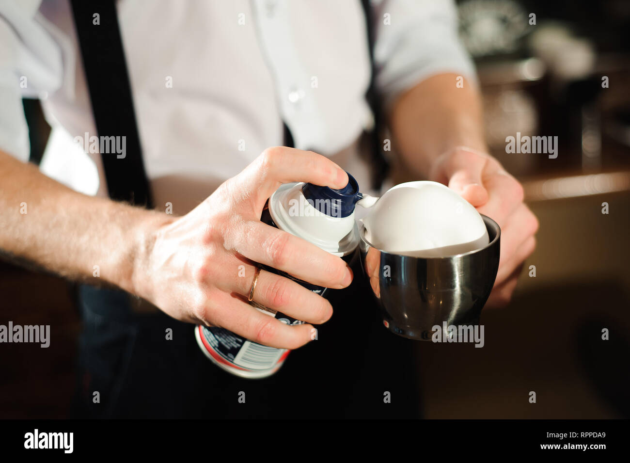 Master cuts hair and beard of men in the barbershop Stock Photo - Alamy