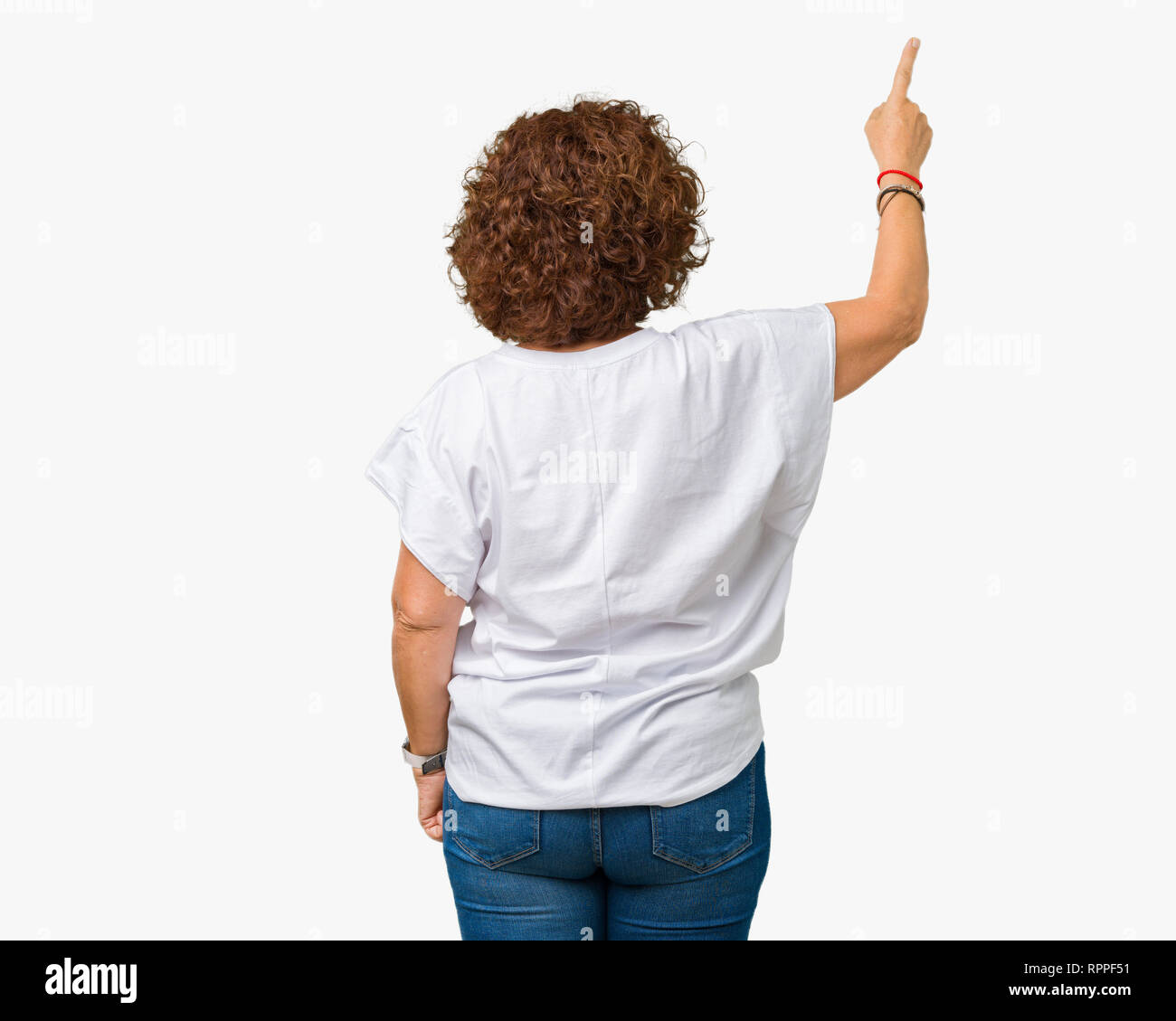 Beautiful middle ager senior woman wearing white t-shirt over isolated ...
