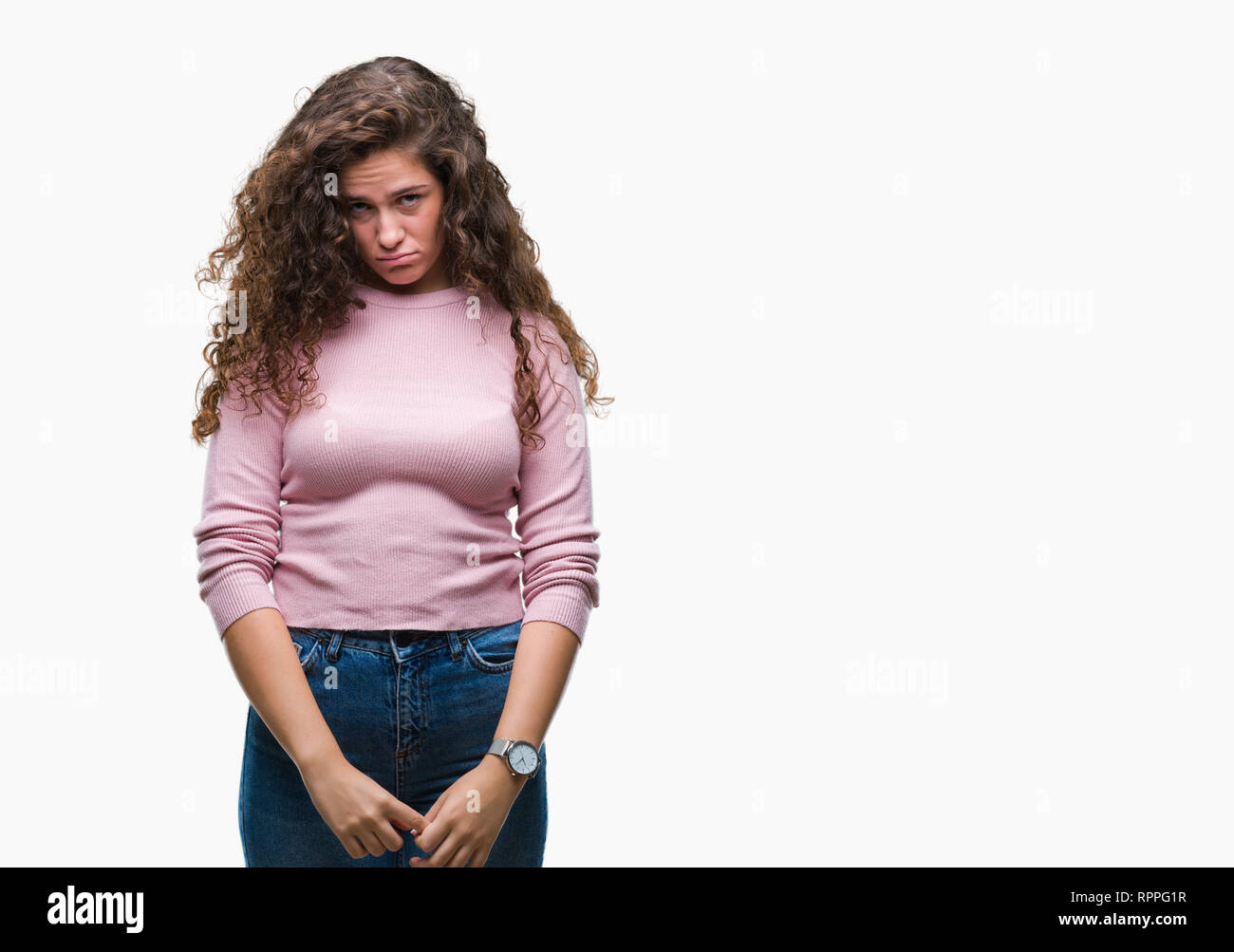 Beautiful brunette curly hair young girl wearing pink sweater over ...