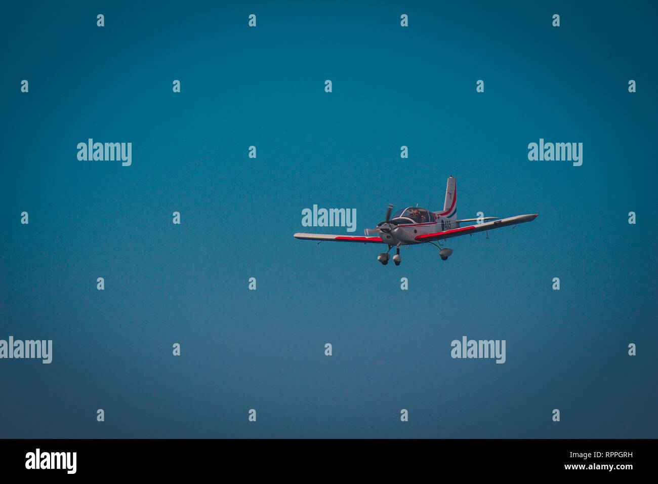 A Croatian small propeller airplane mid flight Stock Photo - Alamy