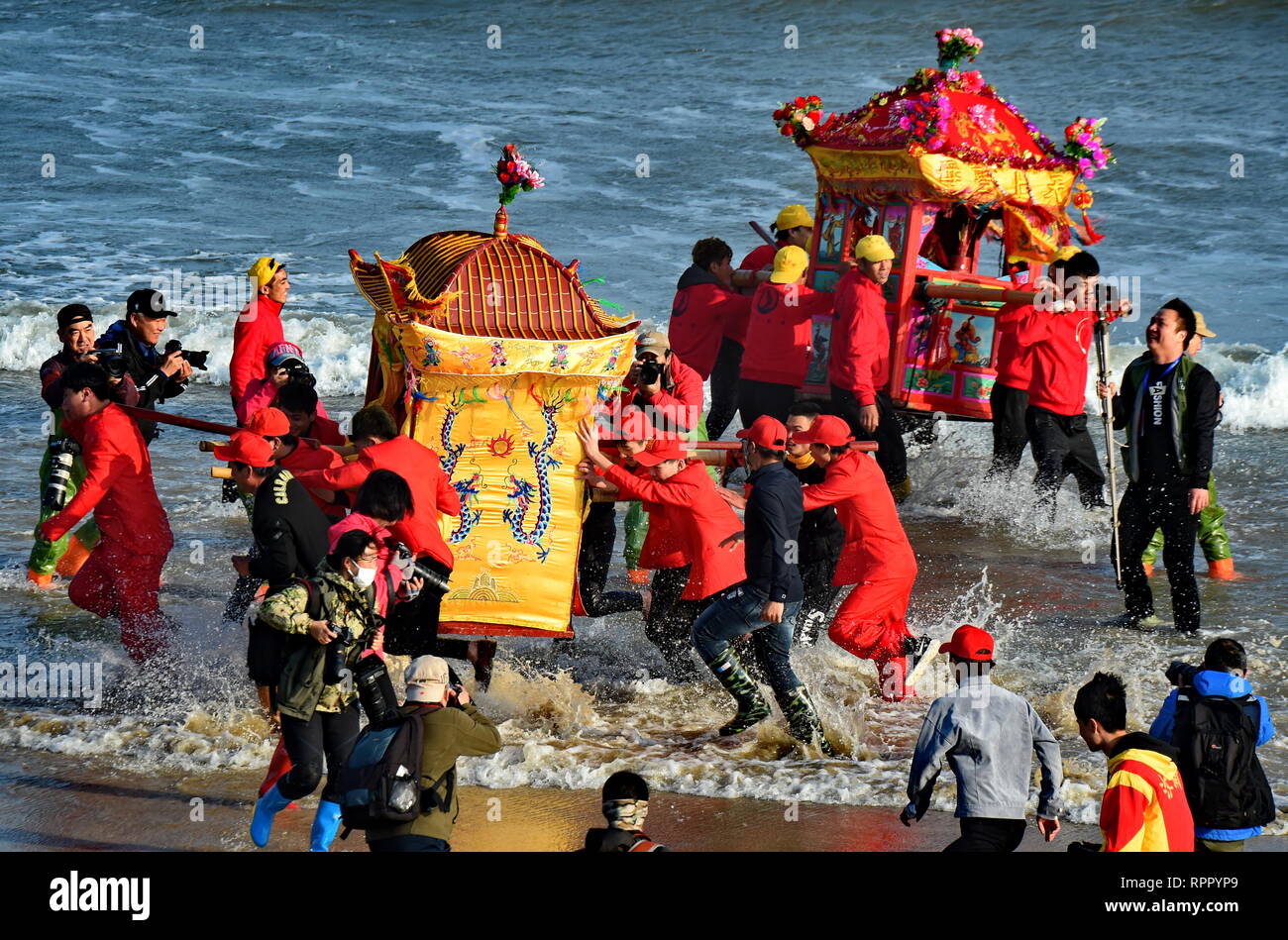 Putian, China's Fujian Province. 22nd Feb, 2019. Fishermen carry a ...