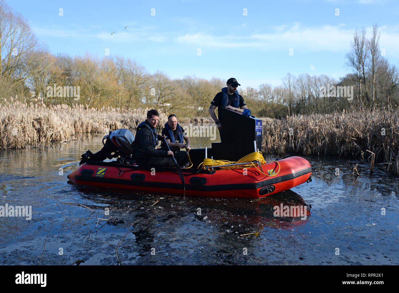 An underwater search rescue team with sonar equipment search one of the ...