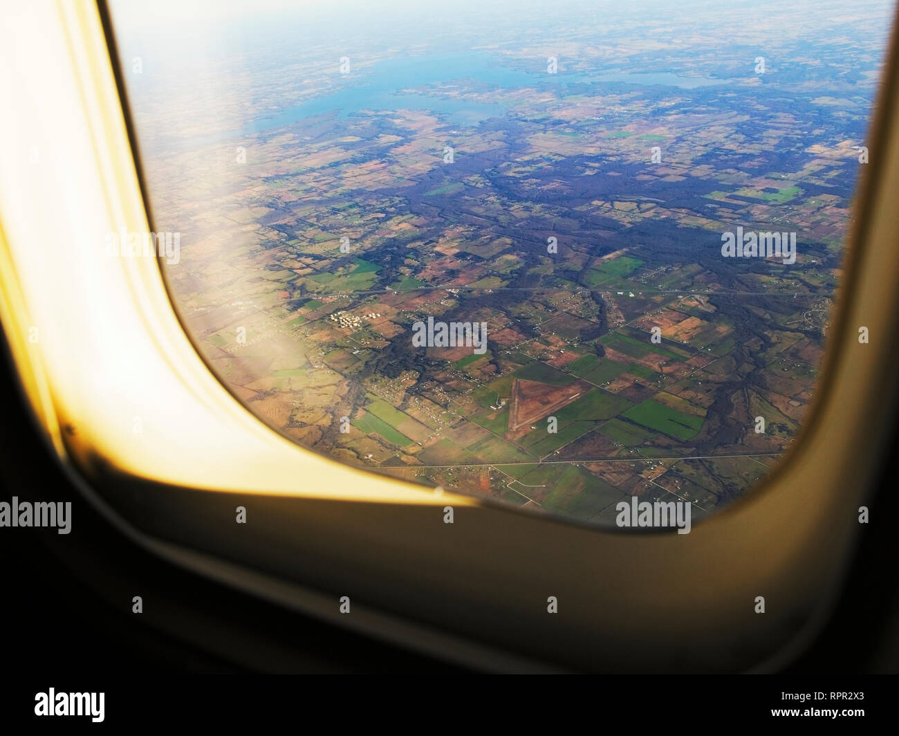 Aerial of Farmland Through Airplane Window Stock Photo - Alamy