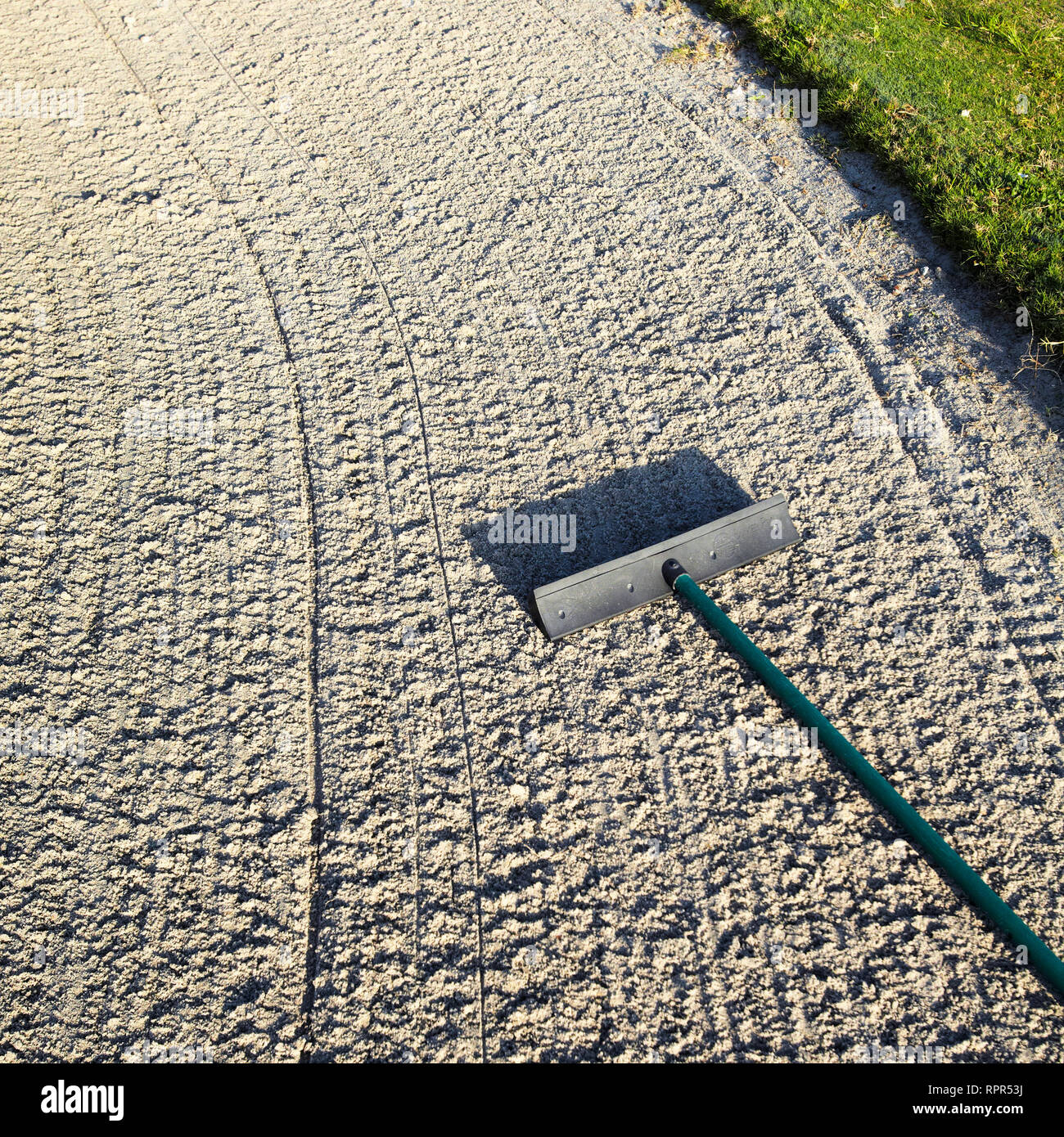 Rake in a Sand Trap Stock Photo - Alamy