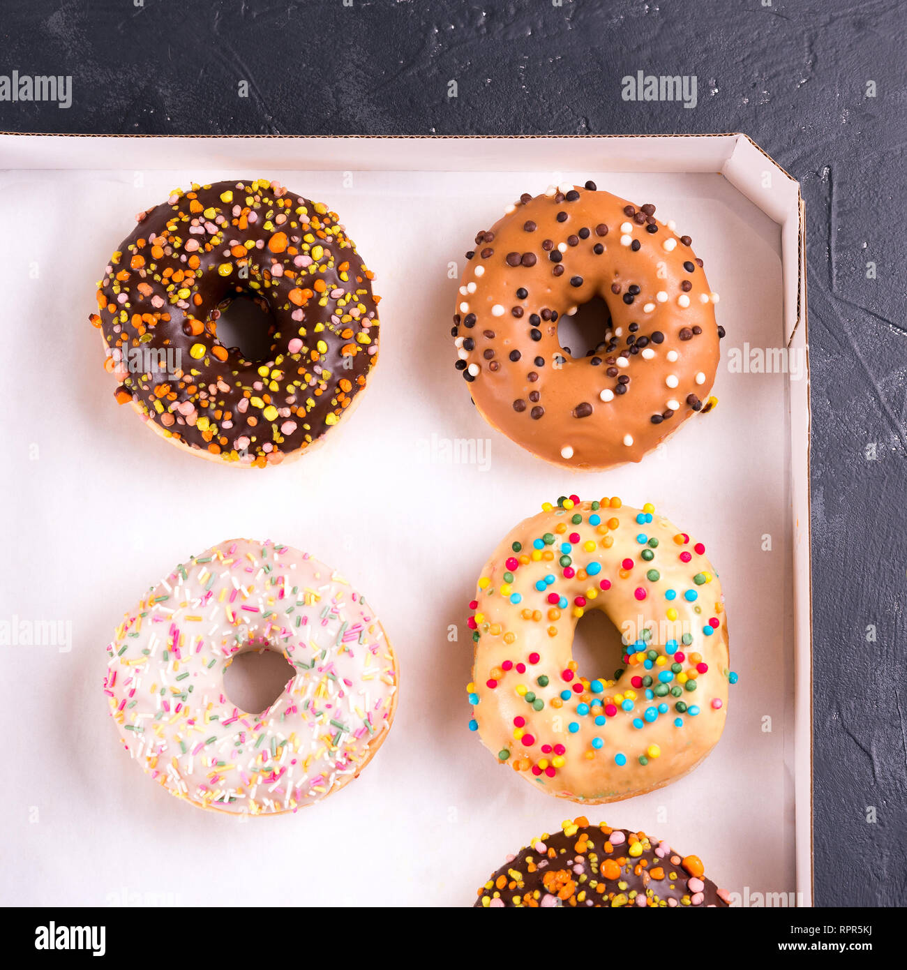 box of sweet fresh donuts with filling Stock Photo - Alamy