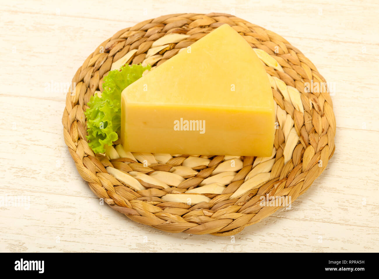 Parmesan cheese triangle Stock Photo - Alamy