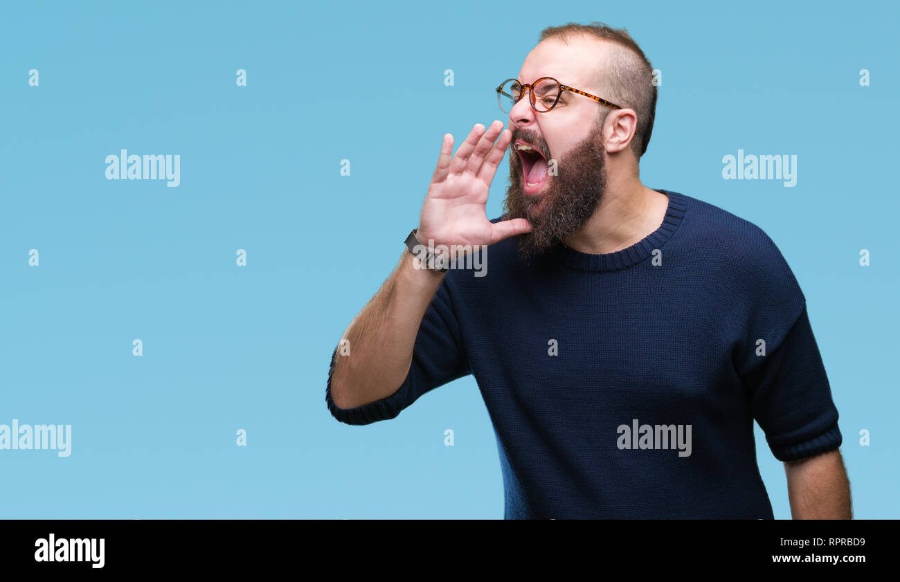 Young caucasian hipster man wearing sunglasses over isolated background ...