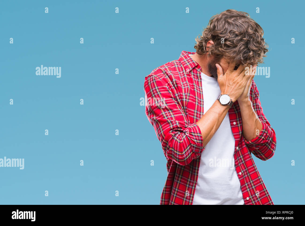 Handsome hispanic model man over isolated background with sad ...