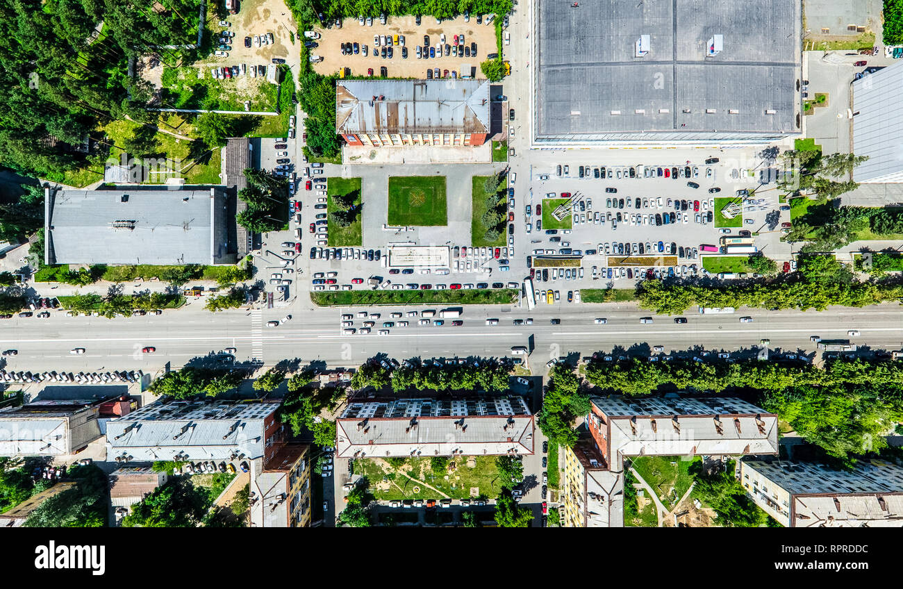 Aerial city view with crossroads and roads, houses, buildings, parks ...