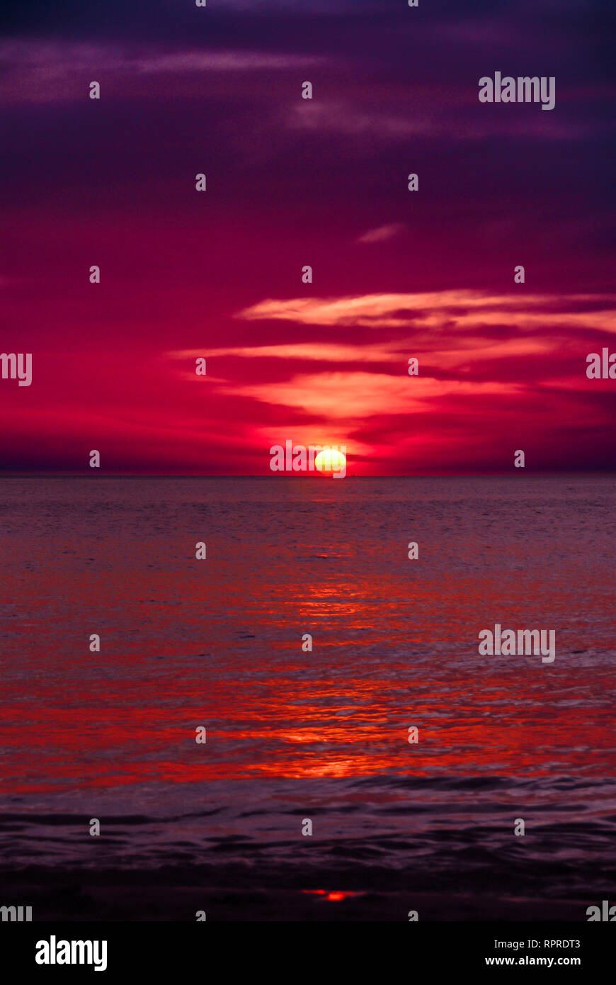 Blood red and dark purple sunset of sun sets over horizon Adaman Sea ...