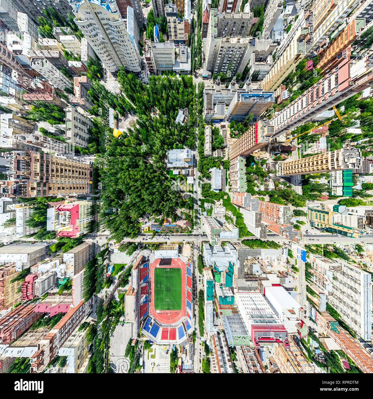 Aerial city view with crossroads and roads, houses, buildings, parks ...