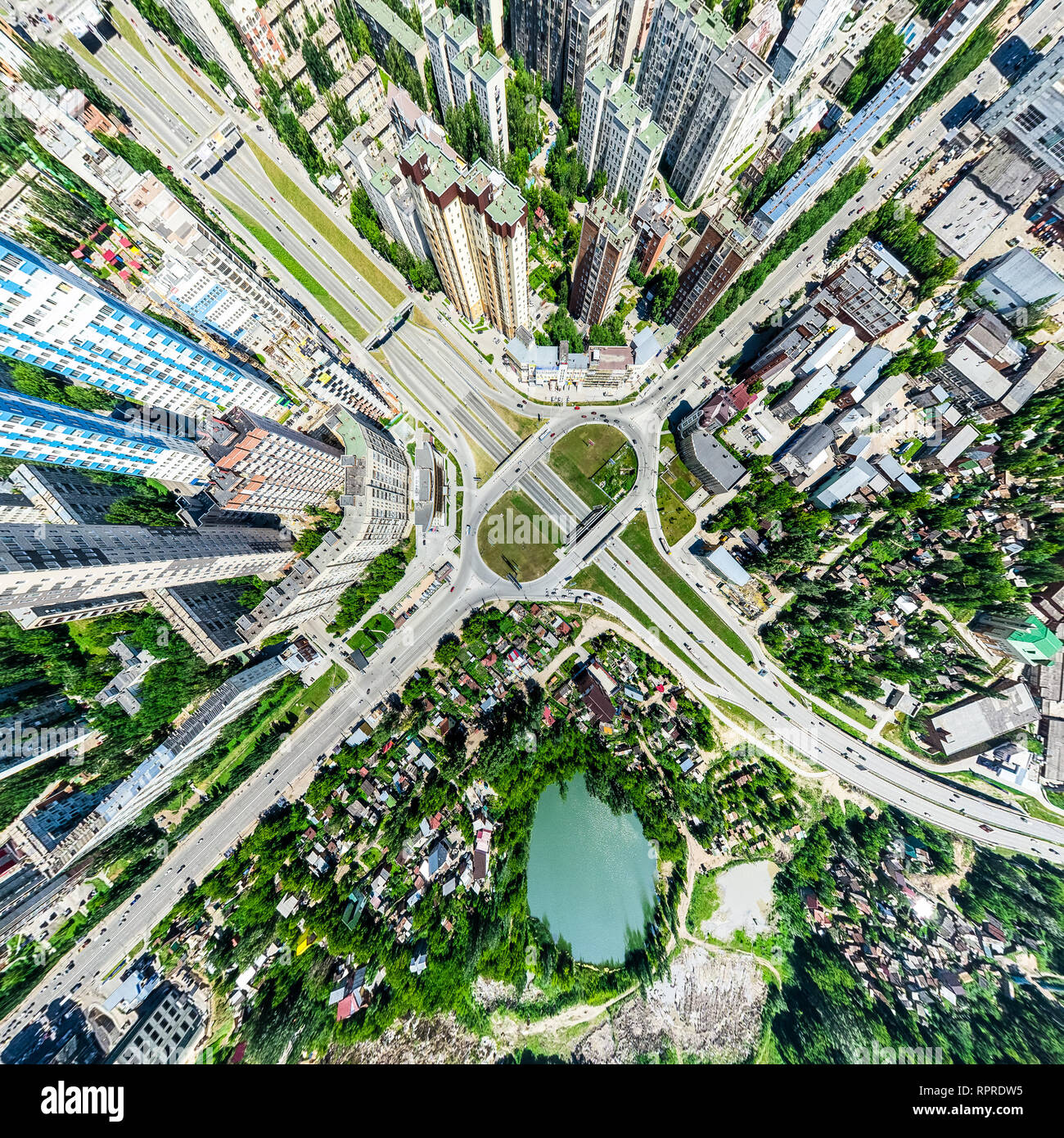Aerial city view with crossroads and roads, houses, buildings, parks ...