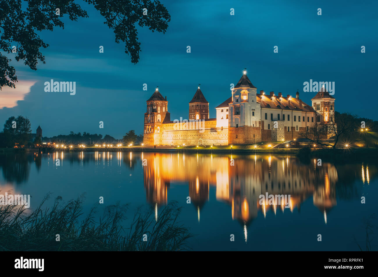 Mir, Belarus. Night Scenic View Of Mir Castle In Evening Illumination ...