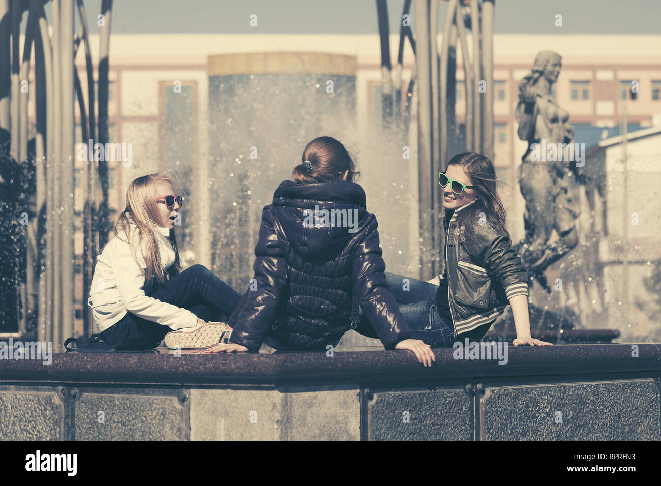 Group of happy teen girls talking in city street Stock Photo - Alamy