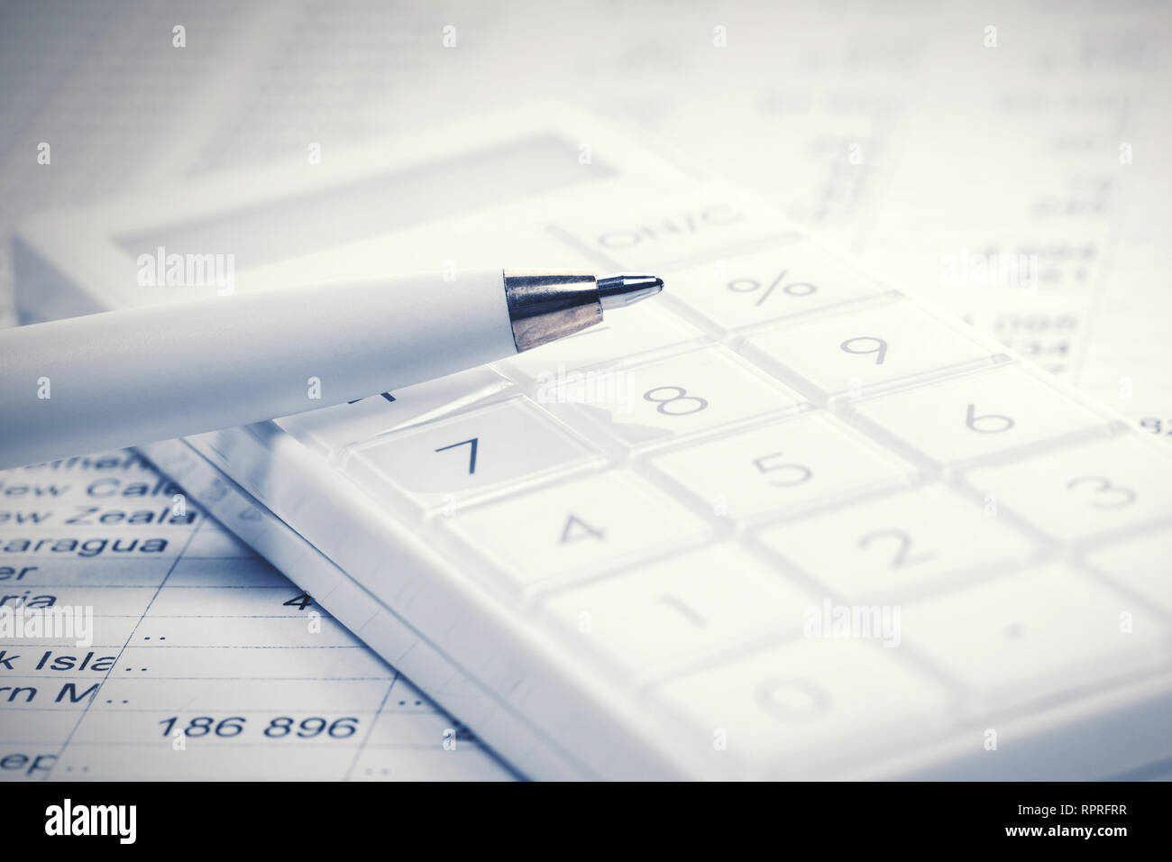 Financial accounting Pen and calculator on balance sheets Stock Photo ...