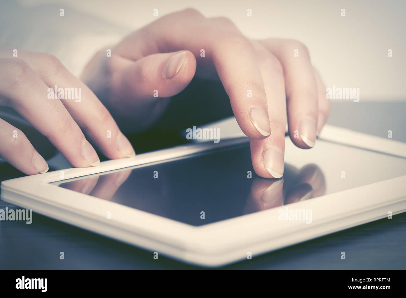 Closeup female hand browsing tablet hi-res stock photography and images ...
