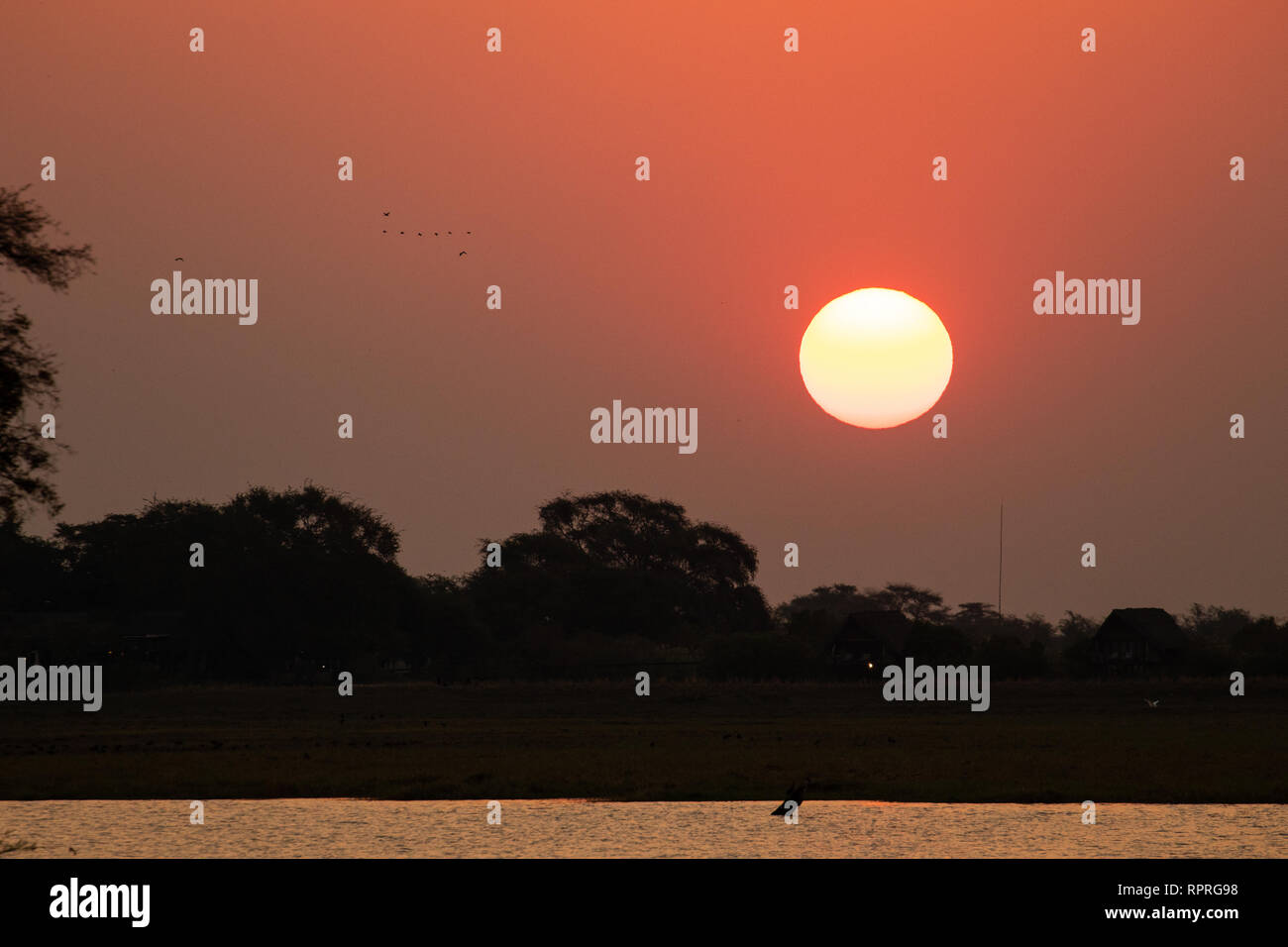 Sunset over the Chobe river in Chobe National Park, on the border of ...