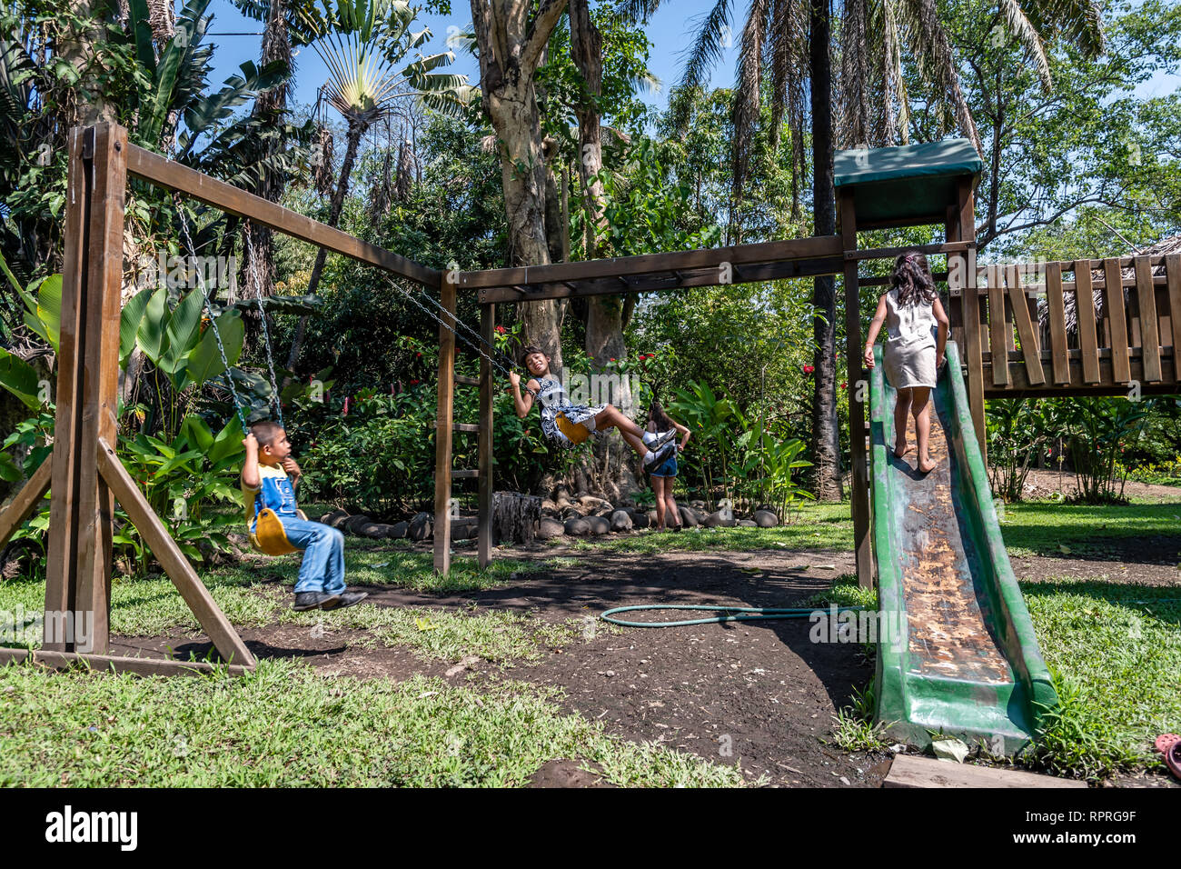 latin family playing on playground in Guatemala Stock Photo - Alamy